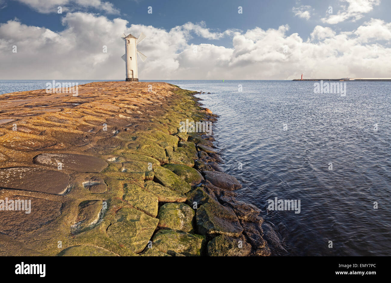 Sunrise over Baltic Sea coast, lighthouse in Swinoujscie, Poland Stock ...
