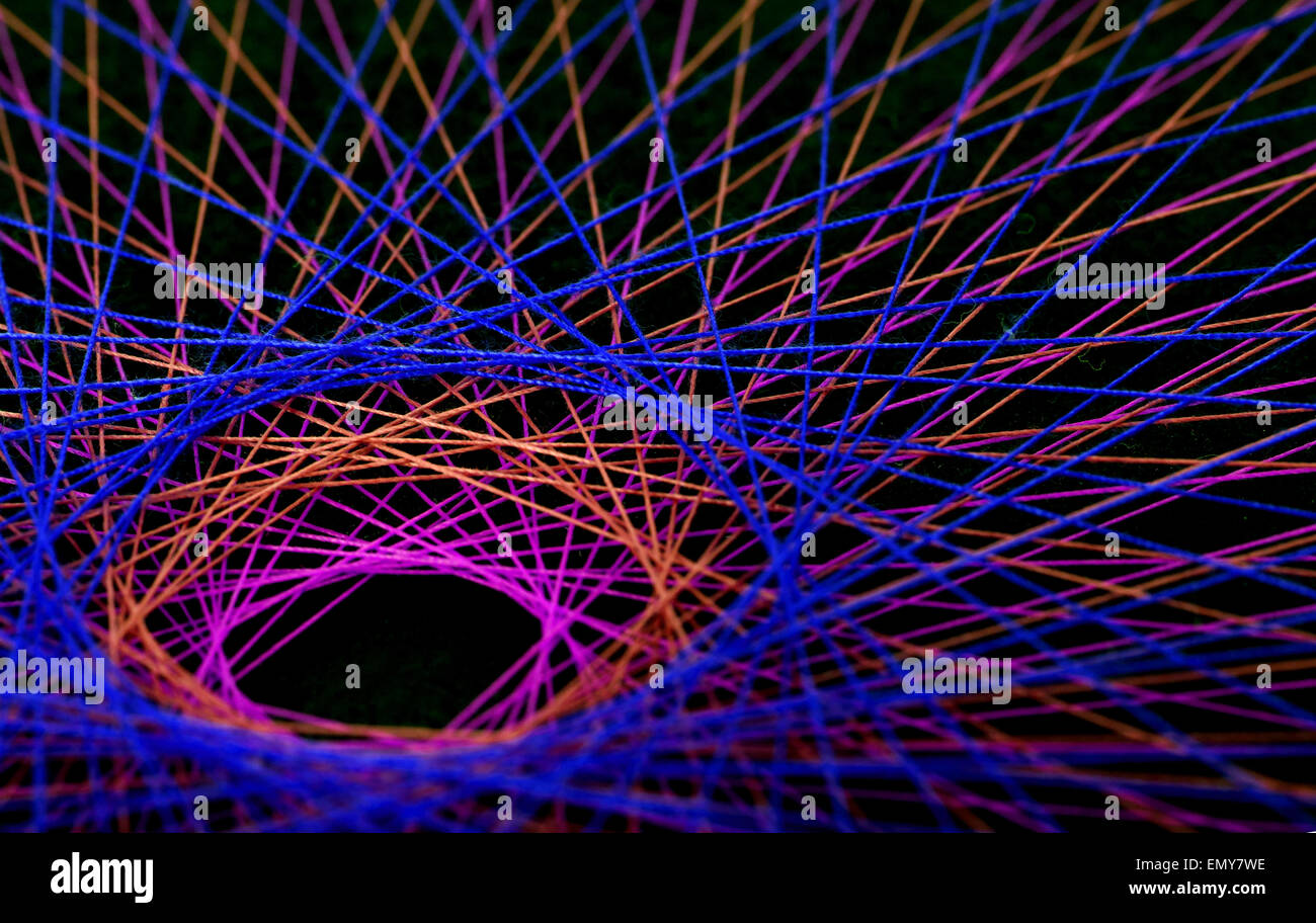 Display of colorful threads on a black panel Stock Photo - Alamy