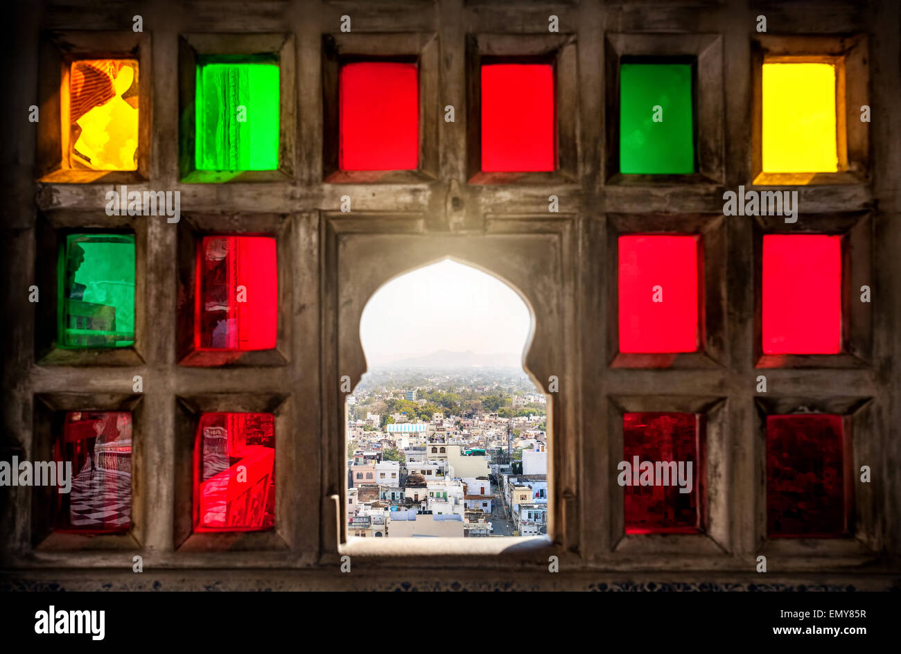 Town view from the colorful mosaic window in City Palace museum of ...