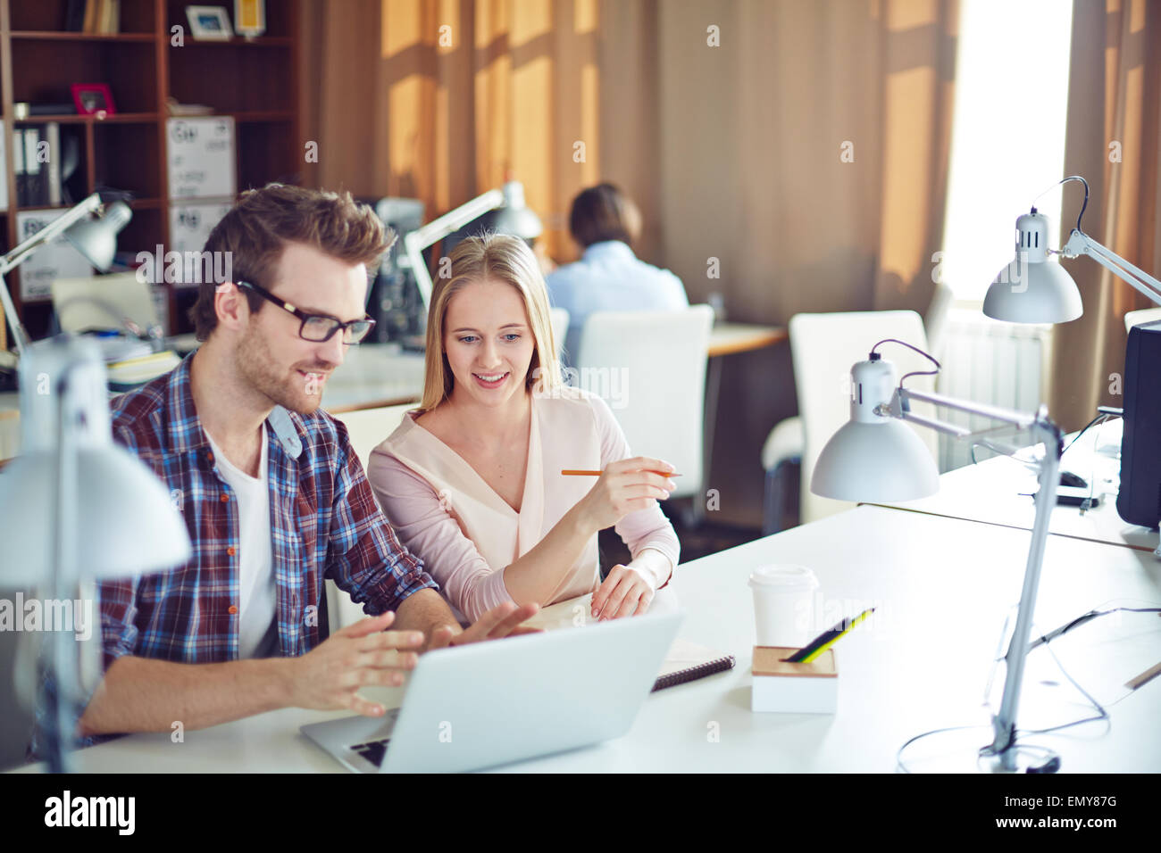 Two confident managers discussing electronic data Stock Photo - Alamy