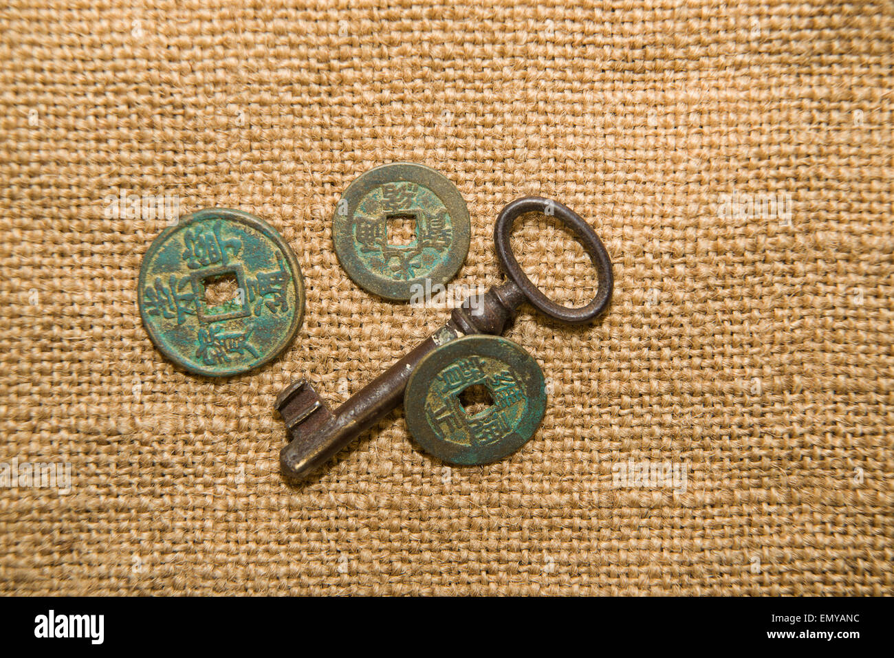 Coins and key on an old cloth hi-res stock photography and images - Alamy