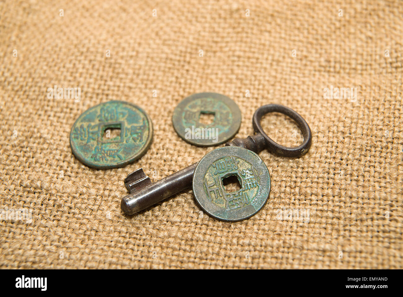 Antique bronze coins and keys on old cloth Stock Photo - Alamy