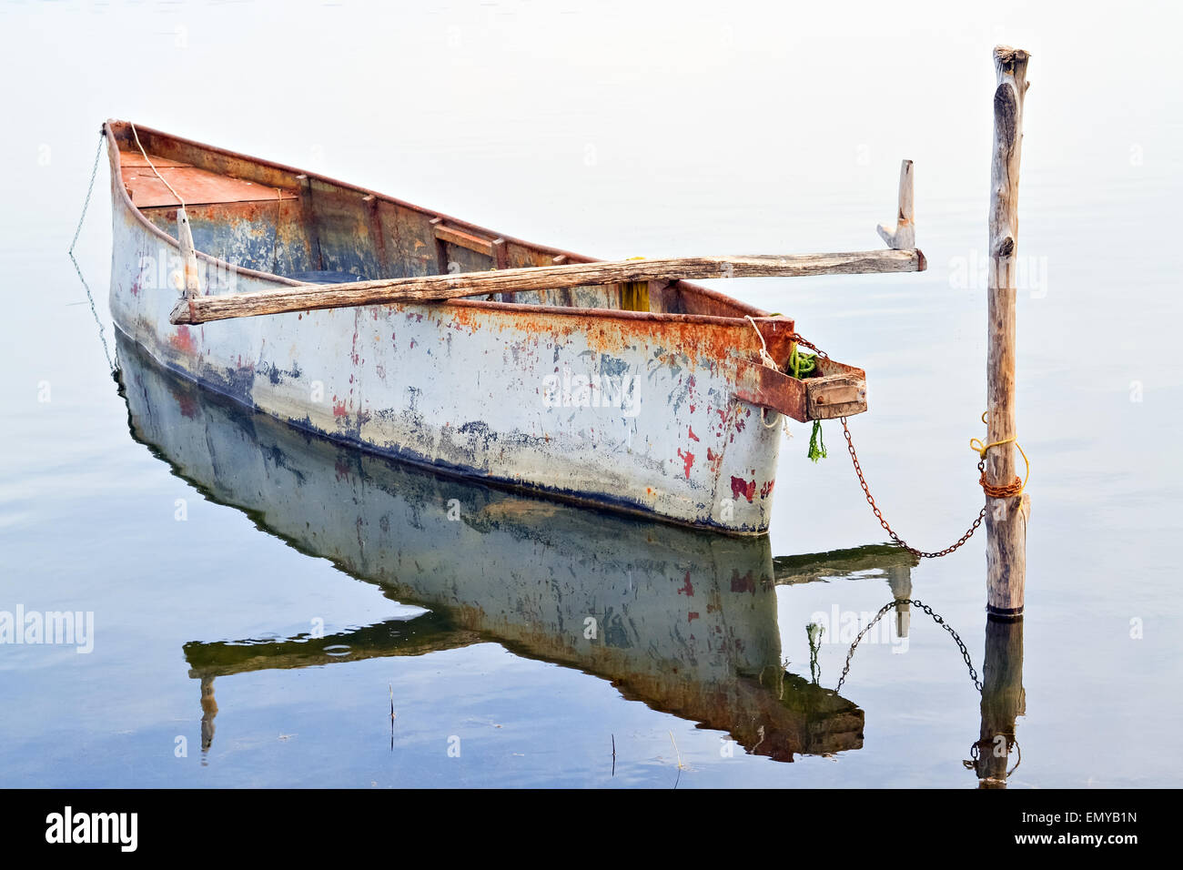 Small rowboat in the lake and clear reflection in the water Stock Photo ...