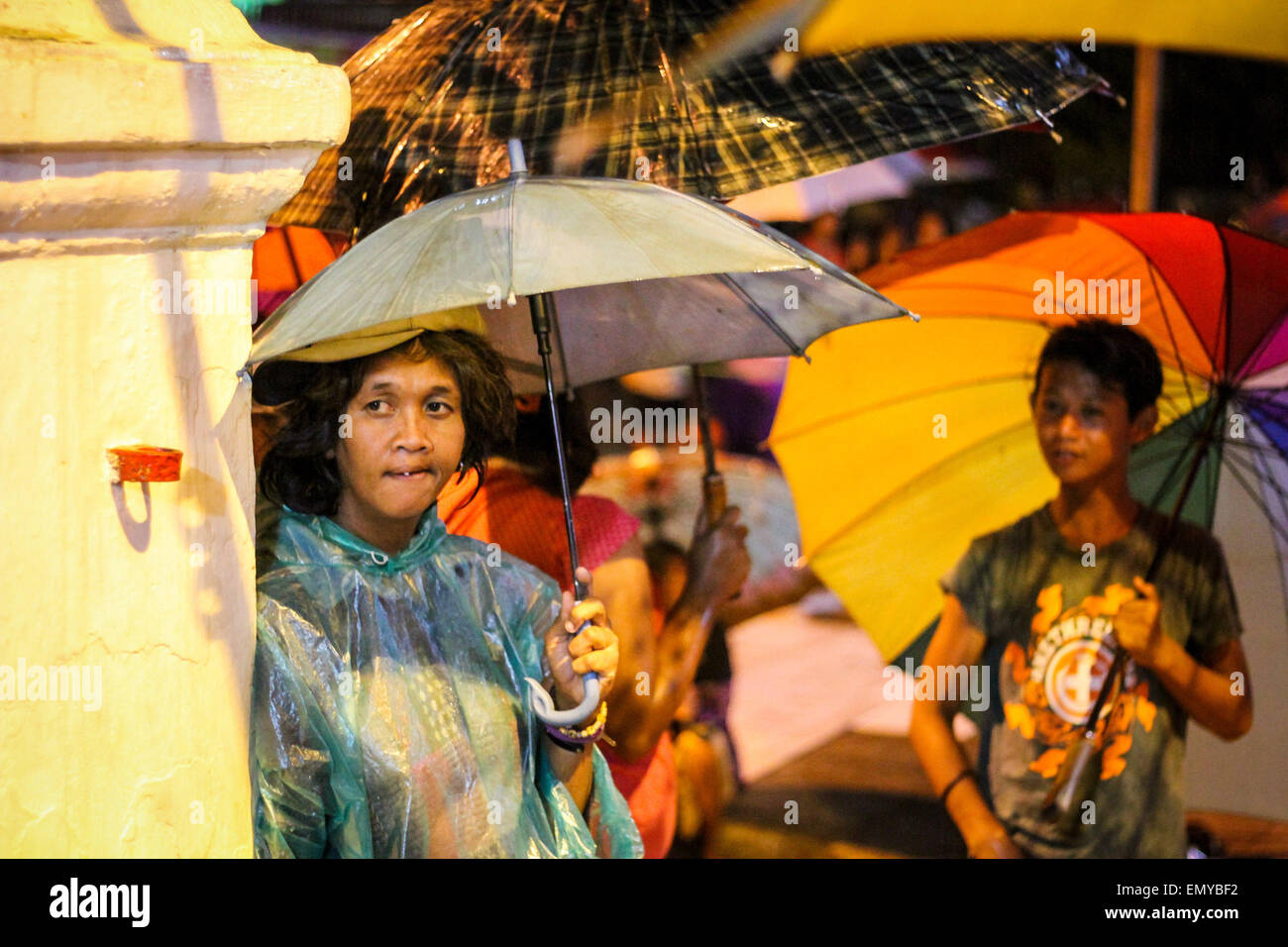 Jakarta, Indonesia. 18th Feb, 2015. When the weather is rainy, people ...