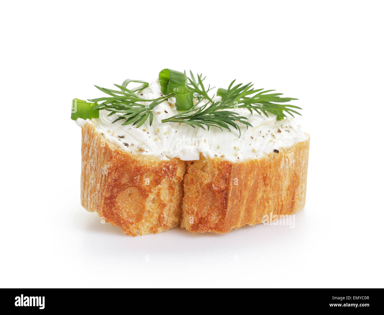 crunchy baguette slice with cream cheese and herbs isolated Stock Photo ...