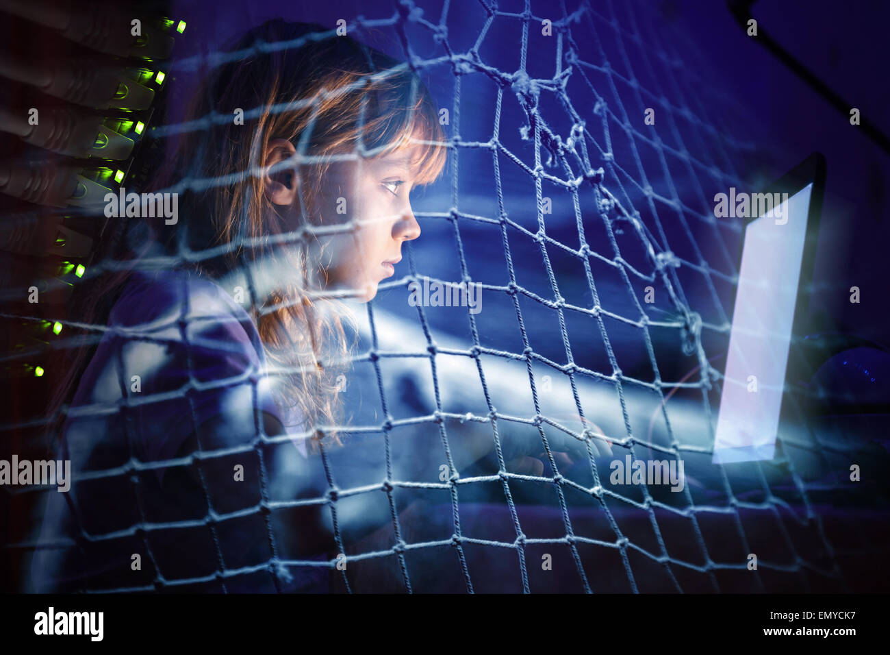 Little girl working on laptop at night in a fishing net, Internet ...