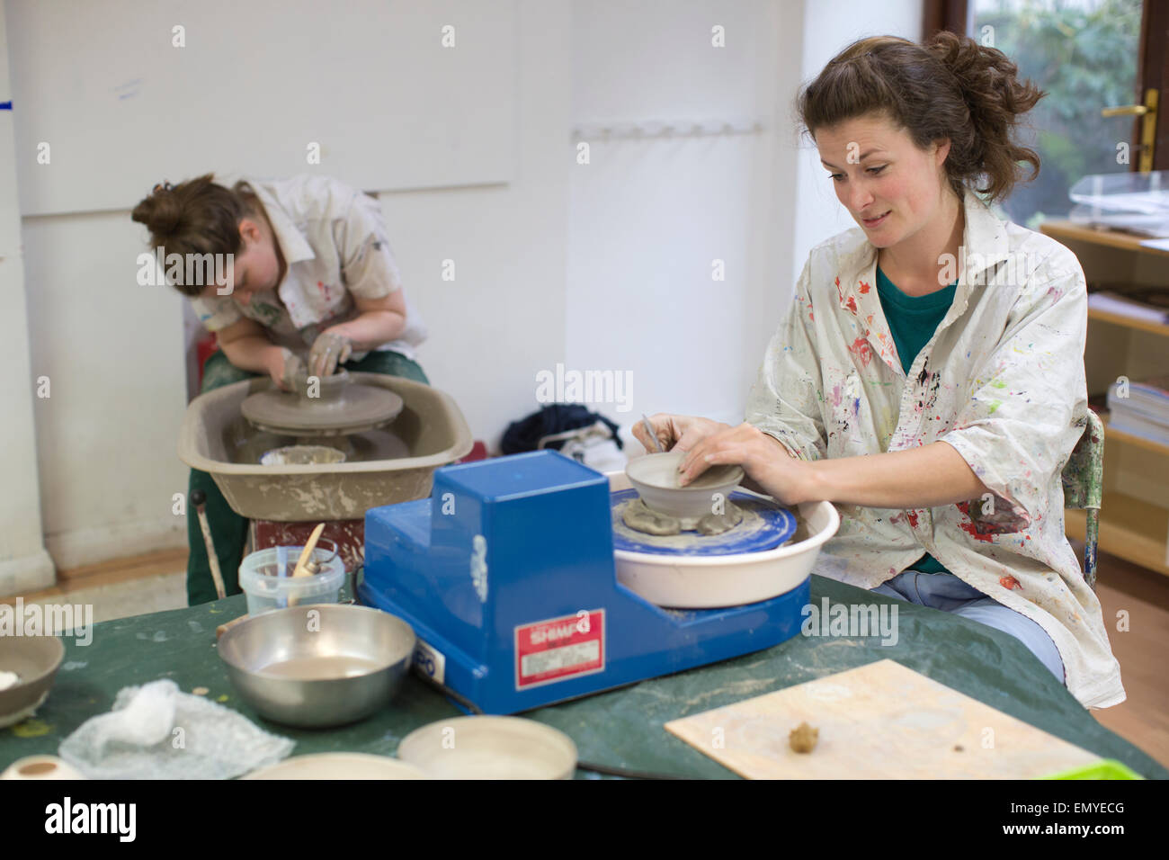 Women participating in a pottery class, art class, making ceramics ...