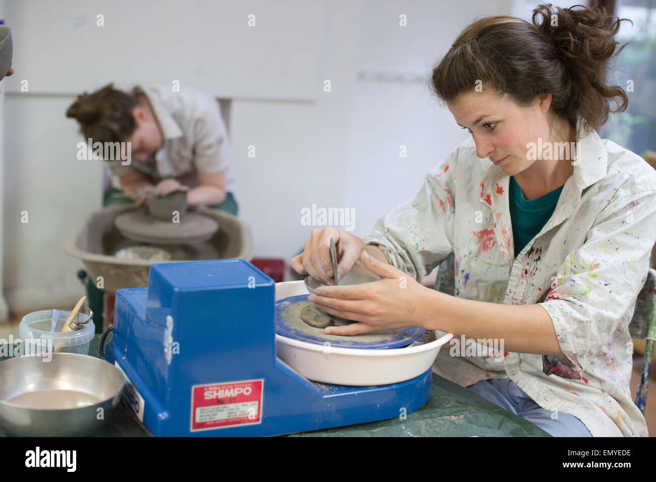 Women participating in a pottery class, art class, making ceramics ...