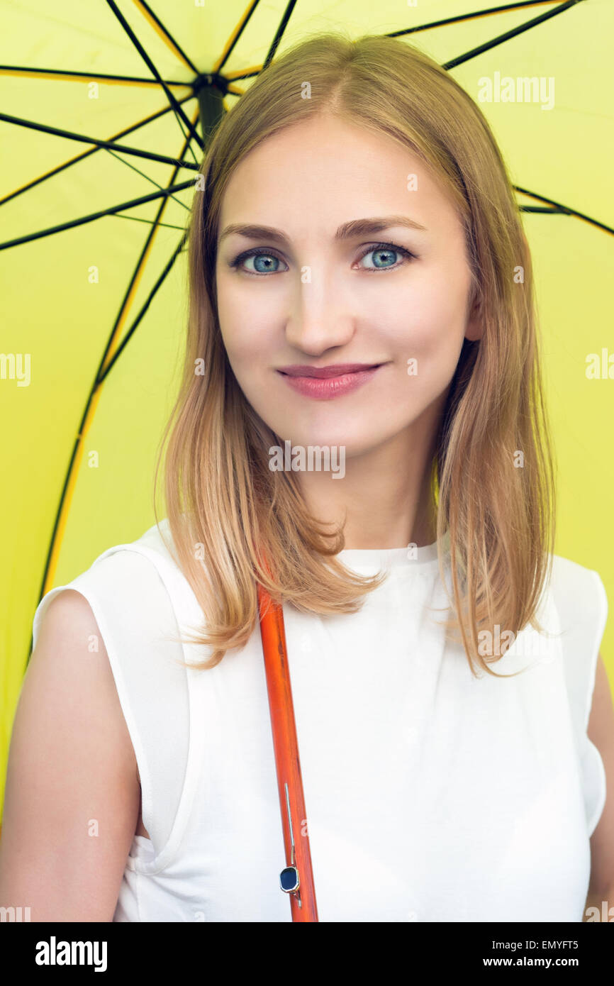 Happy smiling girl keeping an umbrella Stock Photo - Alamy Happy smiling girl keeping an umbrella Stock Photo - Alamy