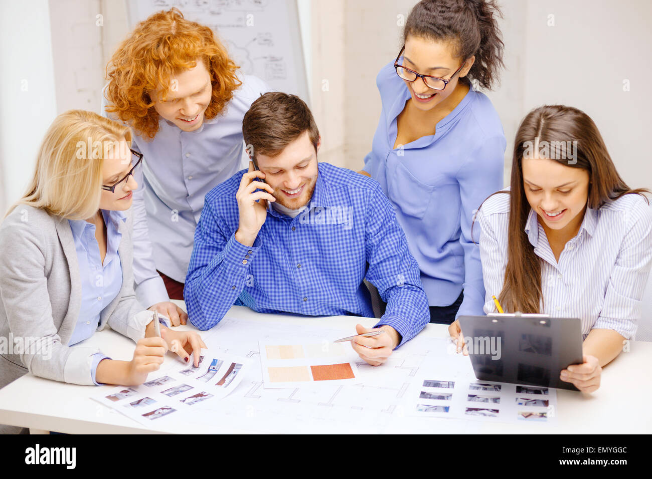creative team with papers and clipboard at office Stock Photo - Alamy