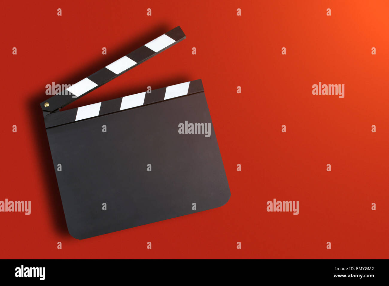 Blank movie production clapper board over red background with co Stock ...