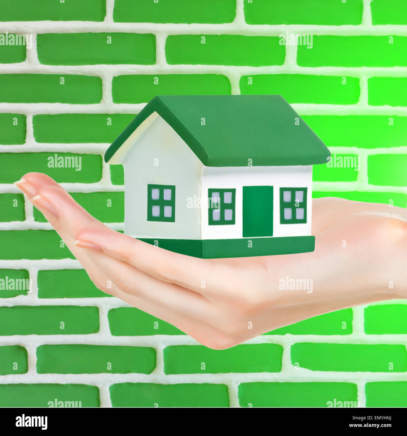 Green house in hand Stock Photo - Alamy
