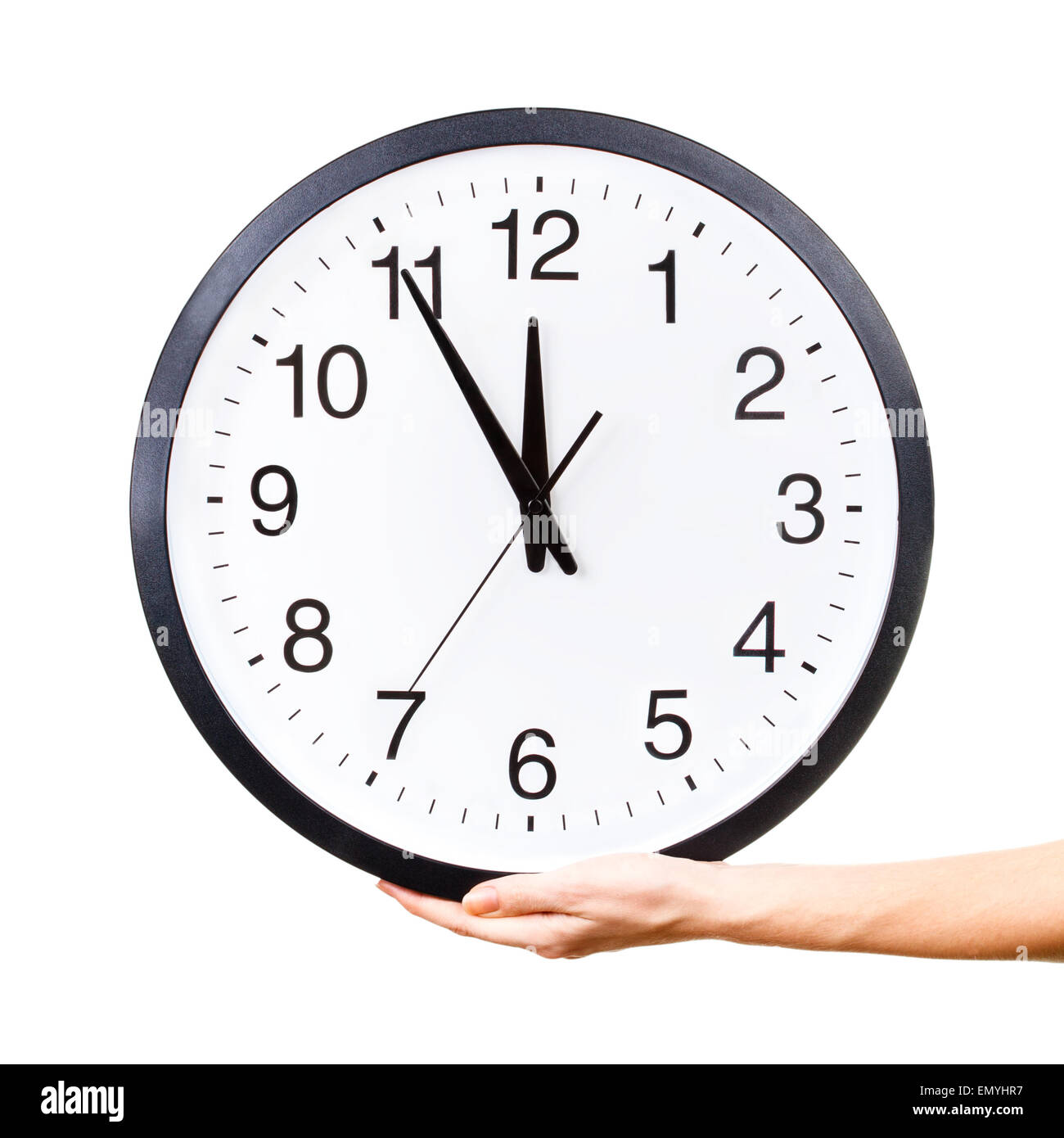 Woman's hand holding a clock Stock Photo - Alamy