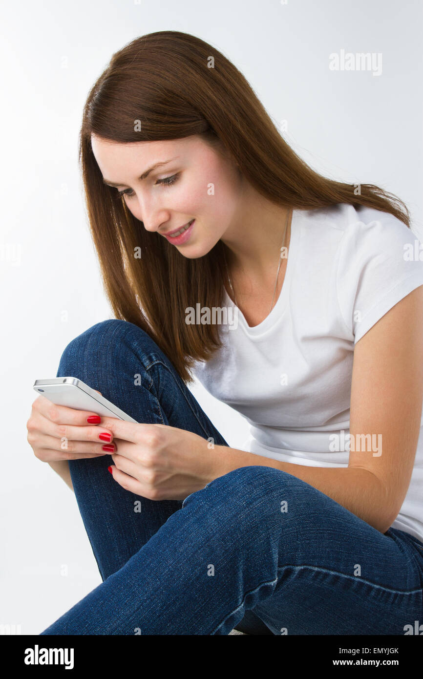 Young woman texting Stock Photo - Alamy