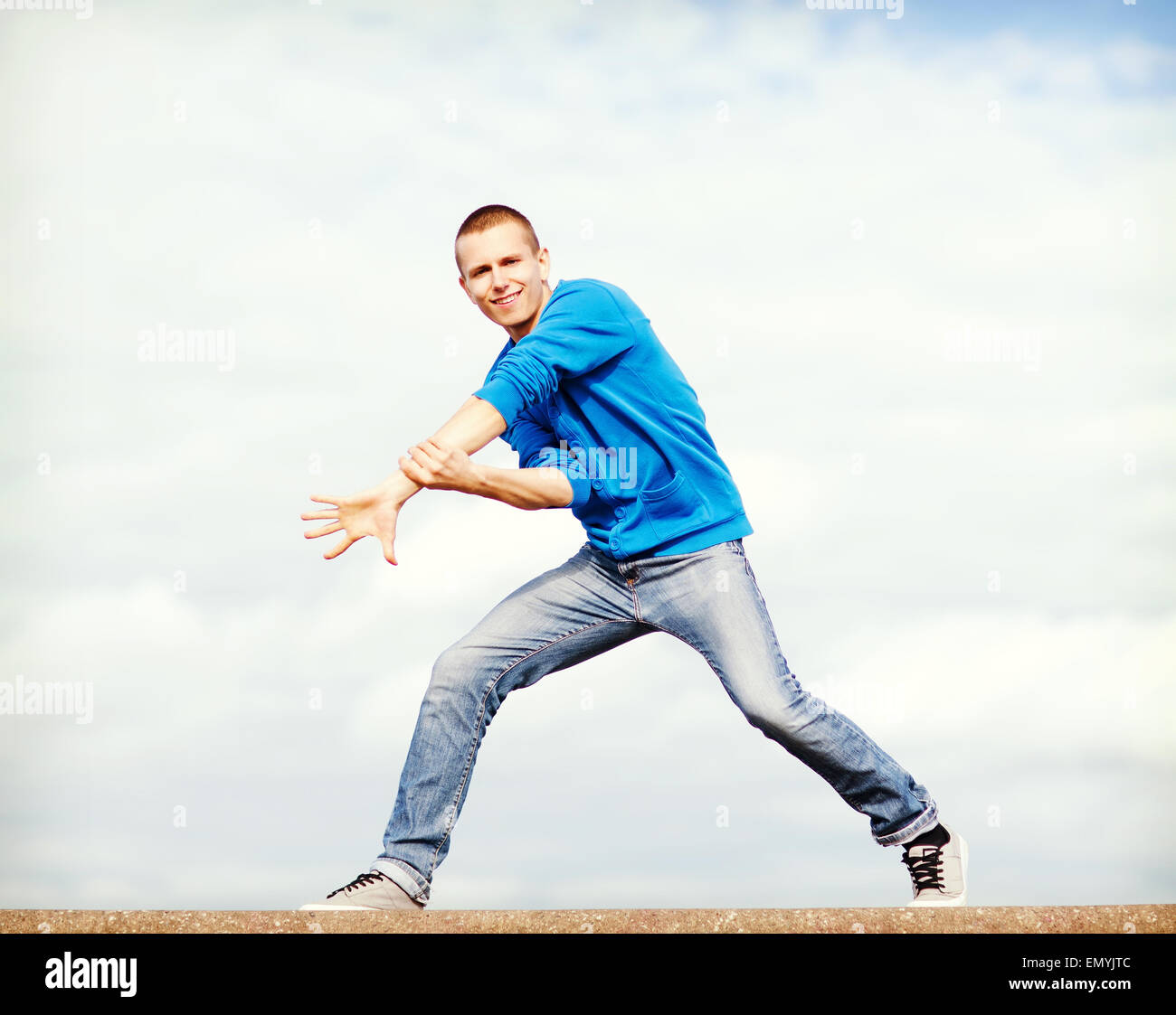 handsome boy making dance move Stock Photo - Alamy