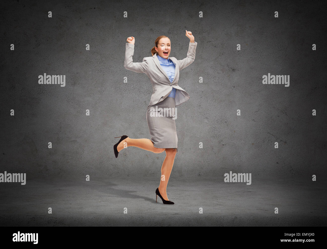 Young woman jumping concrete wall hi-res stock photography and images ...