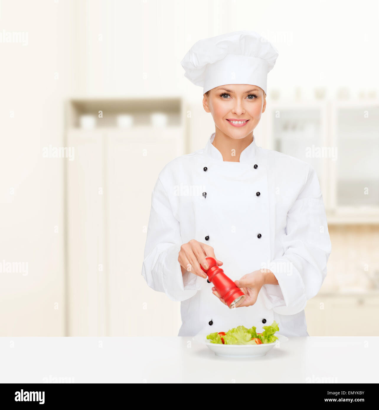 smiling female chef with preparing salad Stock Photo - Alamy