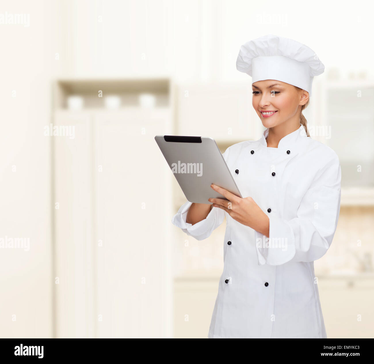 smiling female chef with tablet pc computer Stock Photo - Alamy