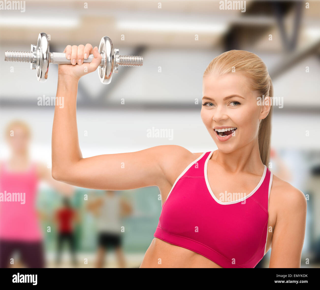 smiling woman with heavy steel dumbbell Stock Photo - Alamy