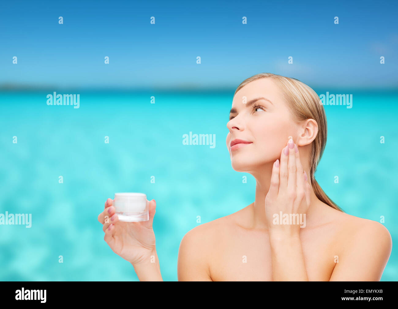 woman applying cream on her skin Stock Photo - Alamy