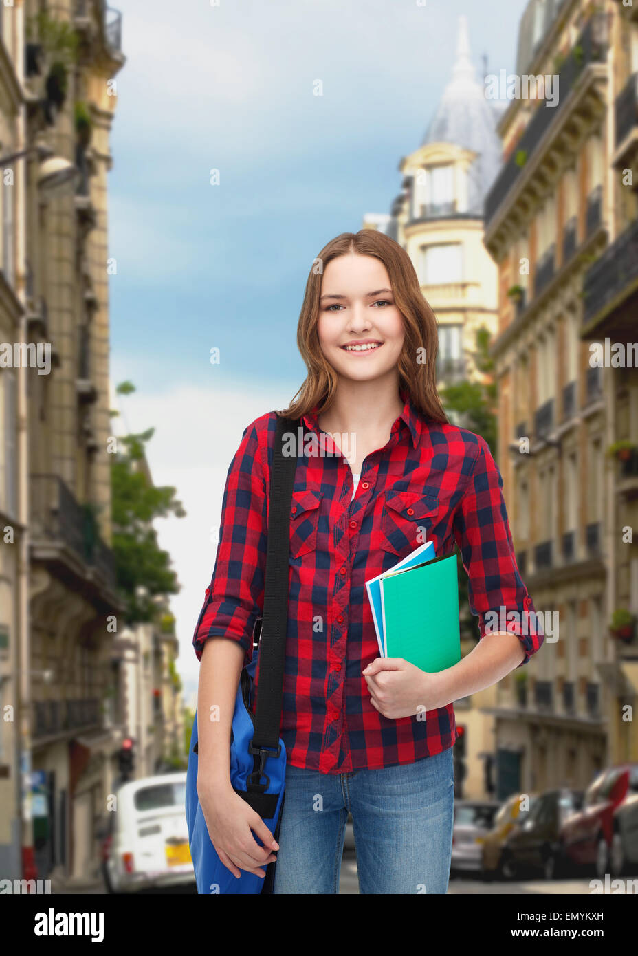 smiling female student with bag and notebooks Stock Photo - Alamy