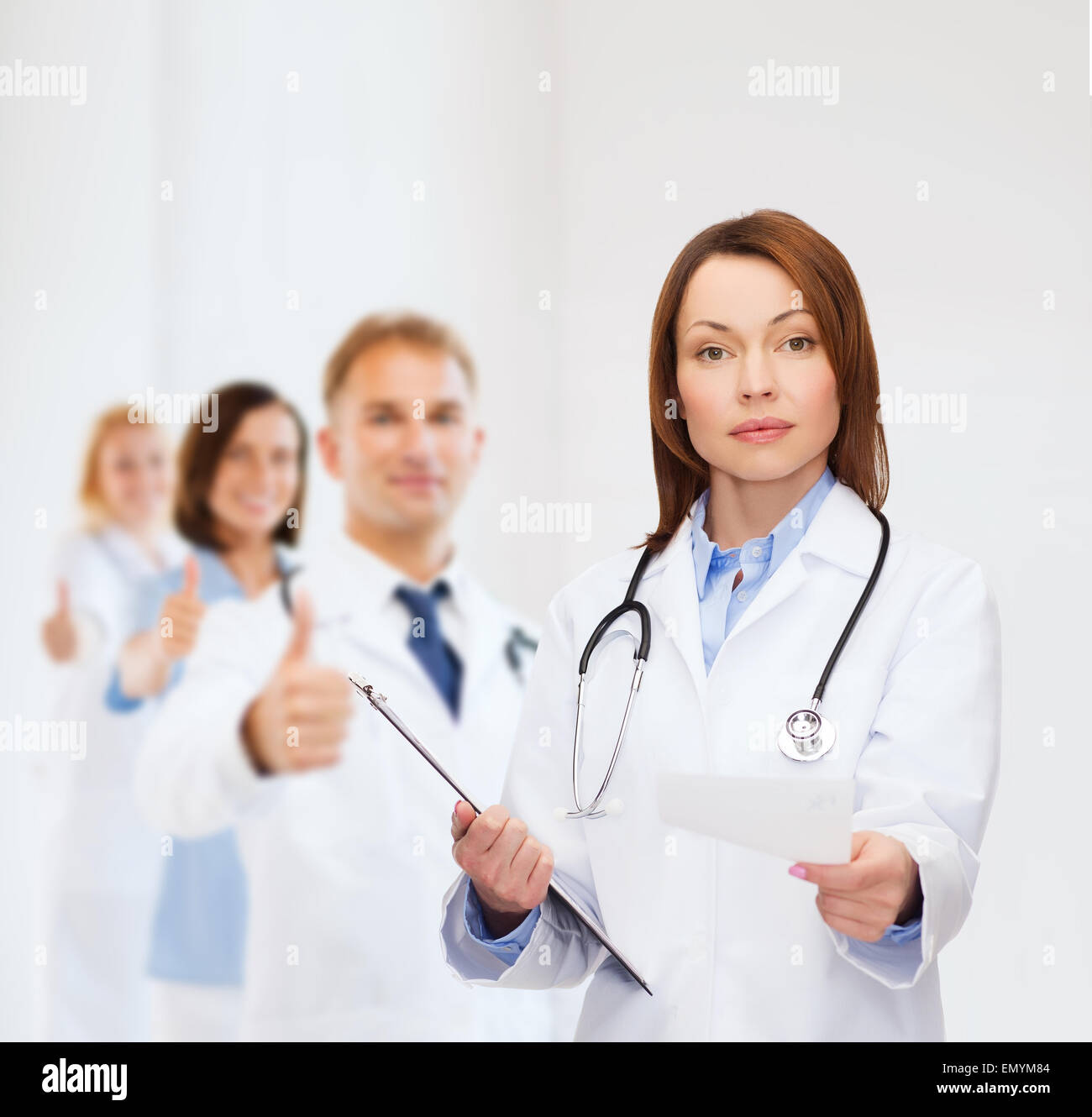 calm female doctor with clipboard Stock Photo - Alamy