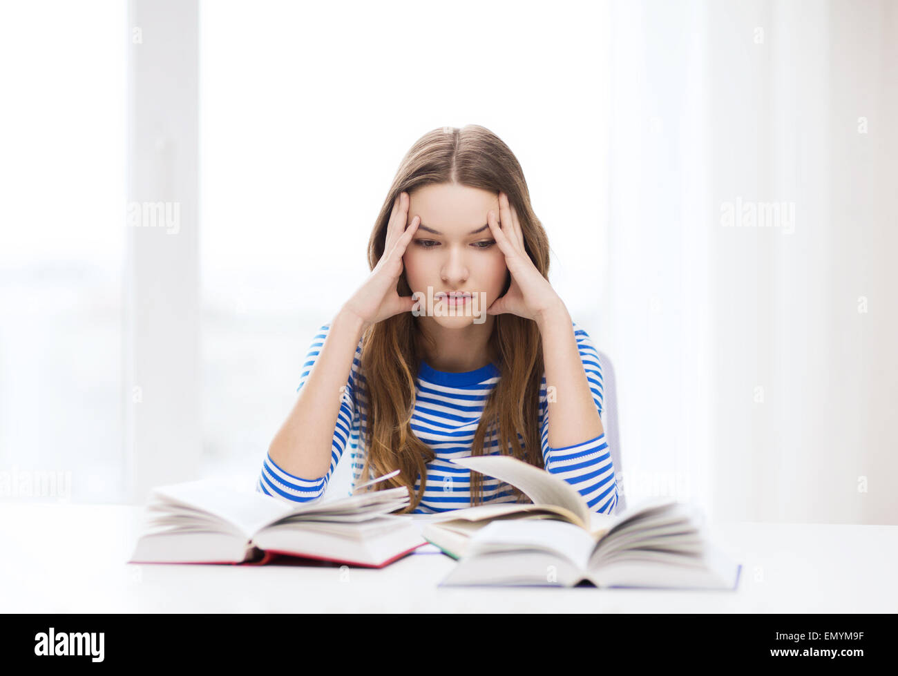 stressed student girl with books Stock Photo - Alamy