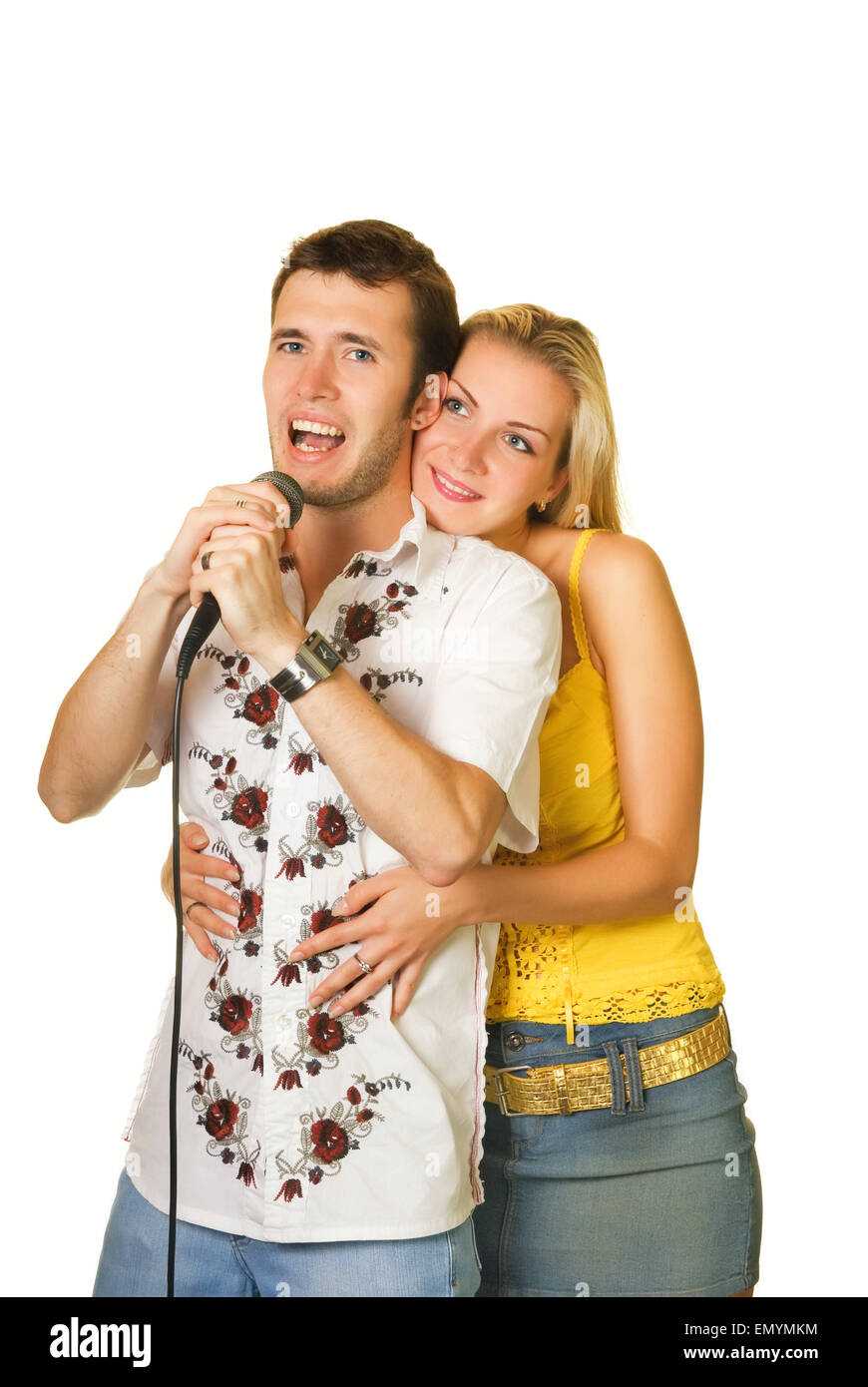 Attractive young couple singing karaoke isolated on white background ...