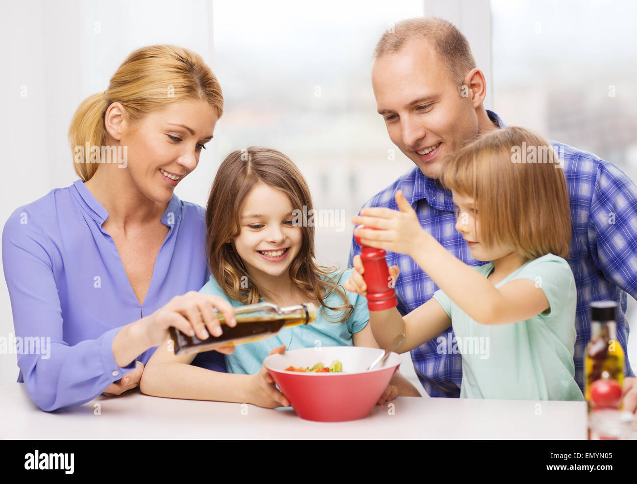 happy family with two kids eating at home Stock Photo - Alamy