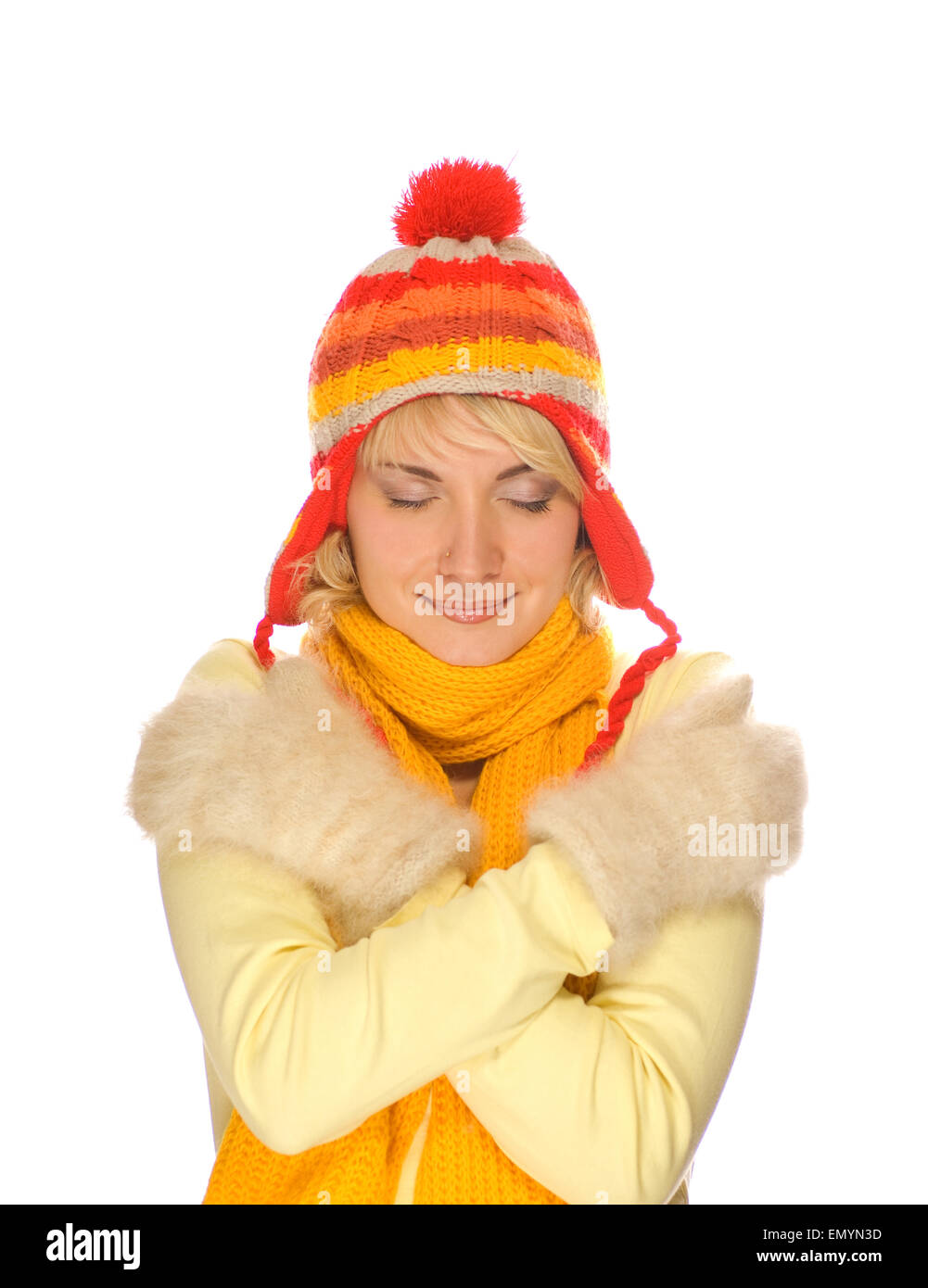 Frozen girl in colorful winter clothing over white background Stock ...