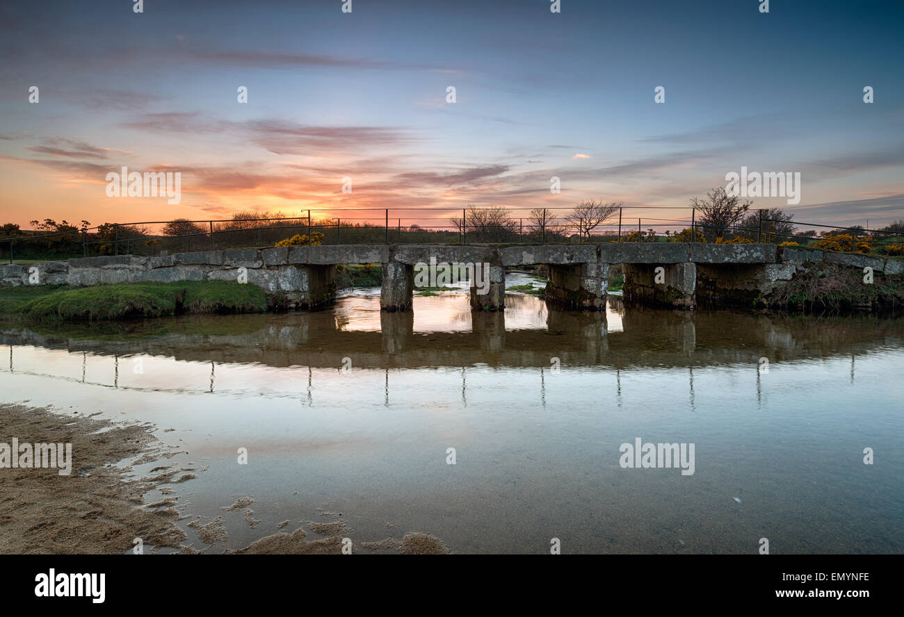 Sunset over Delford Bridge spanning the De lank river on Bodmin Moor in ...