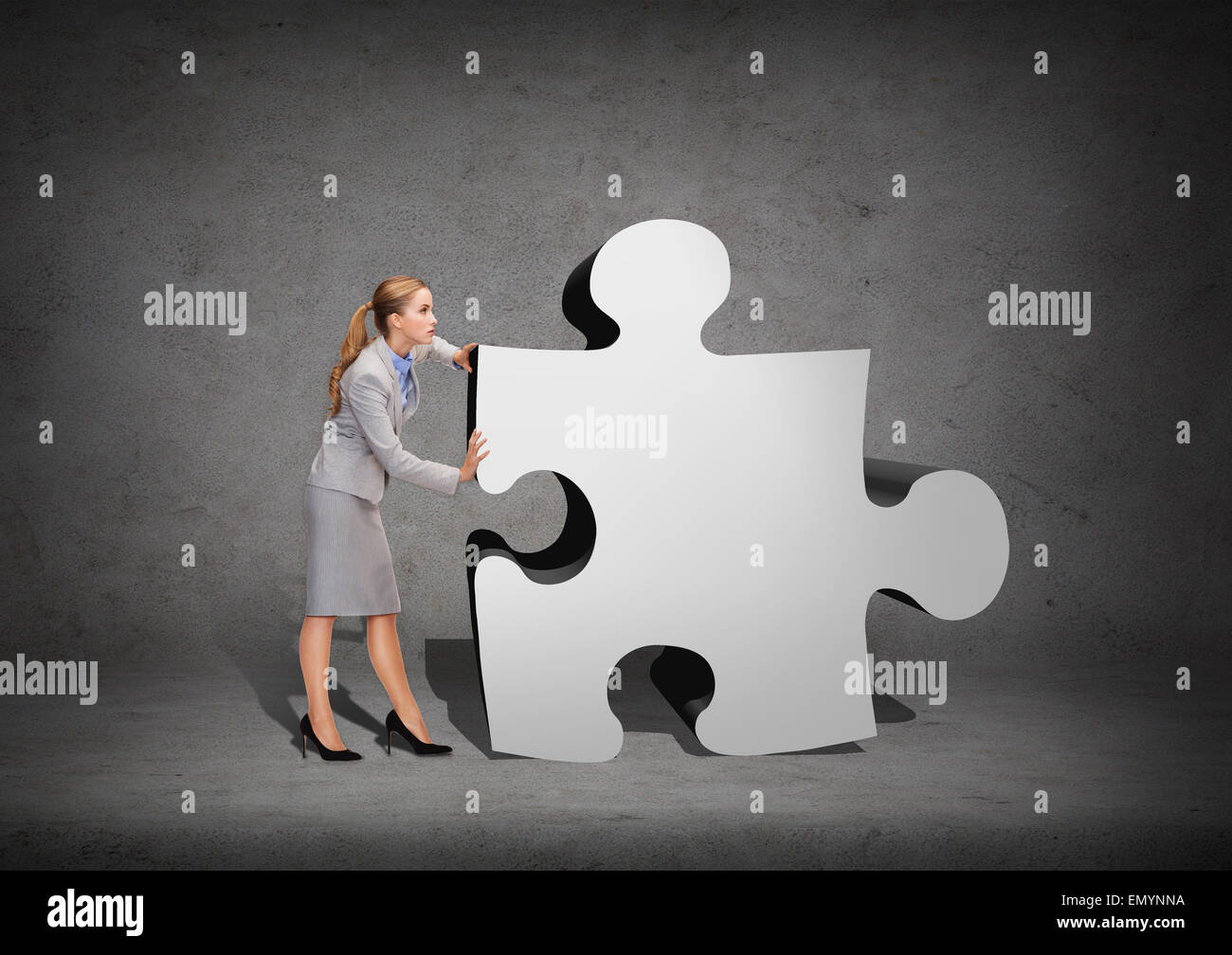 busy businesswoman pushing puzzle piece Stock Photo - Alamy