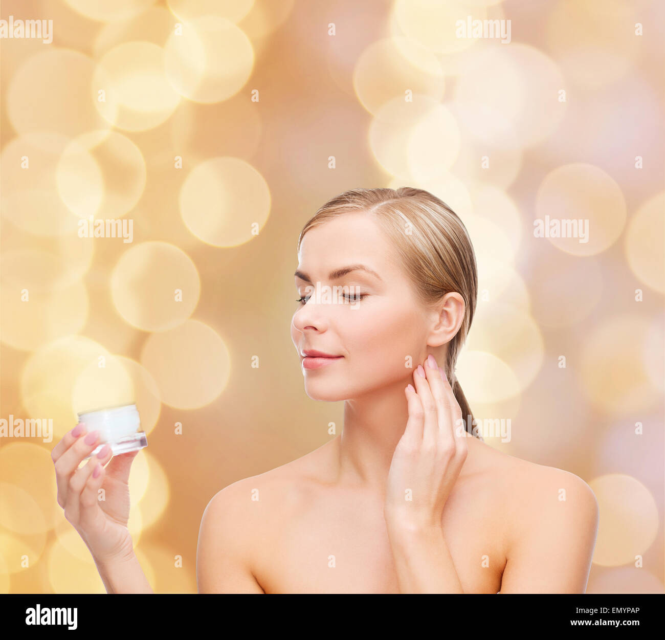 woman applying cream on her skin Stock Photo - Alamy