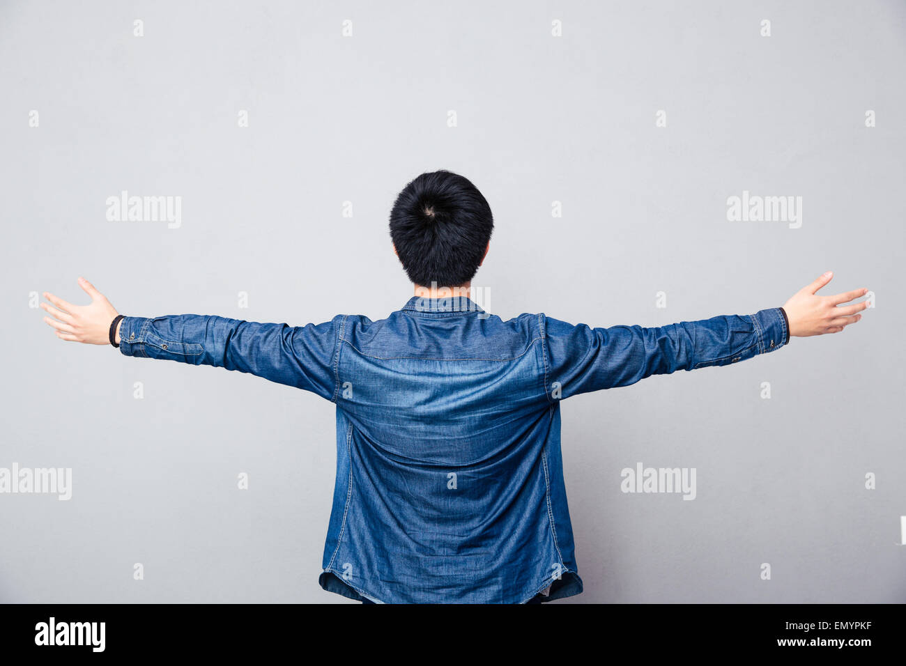 Back view portrait of asian man over gray background Stock Photo - Alamy