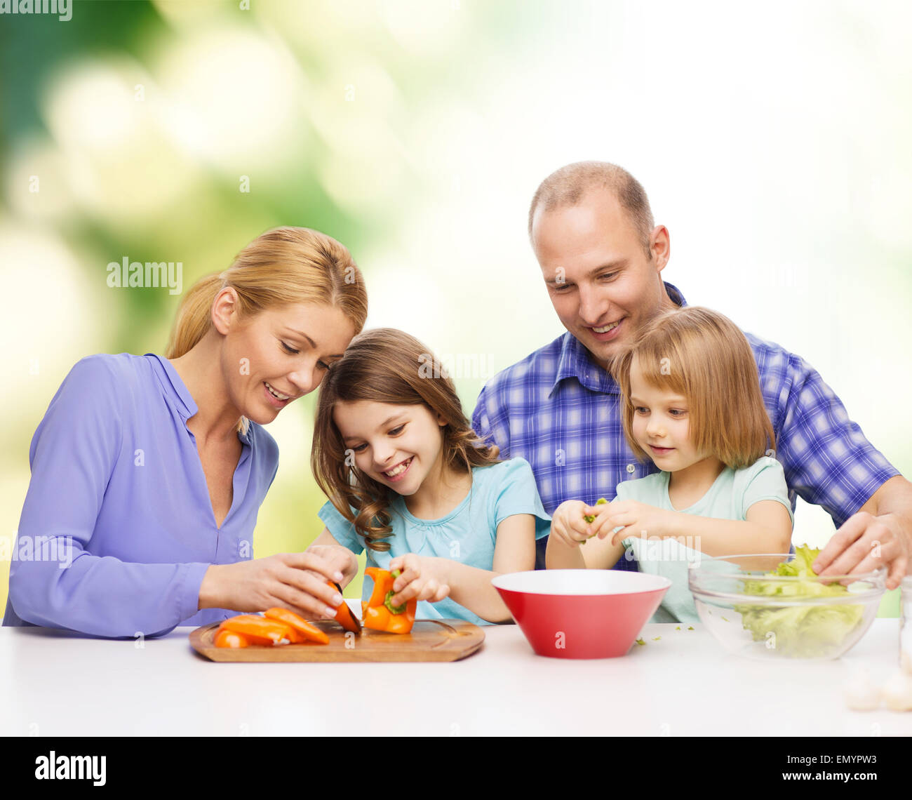 happy family with two kids making dinner at home Stock Photo - Alamy