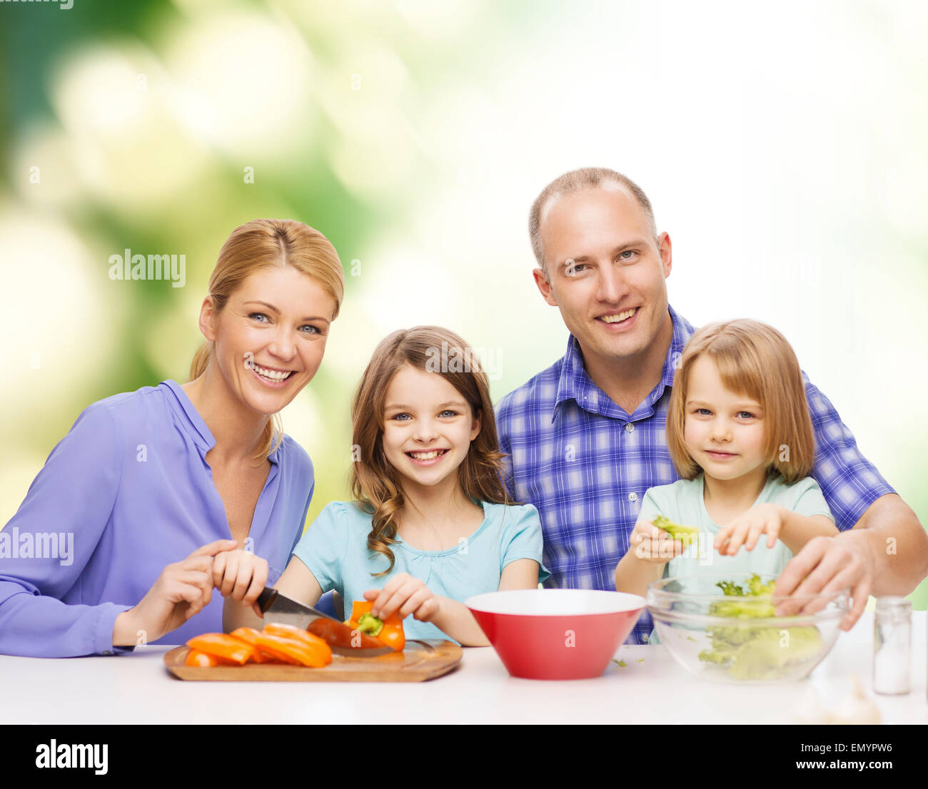 happy family with two kids making dinner at home Stock Photo - Alamy