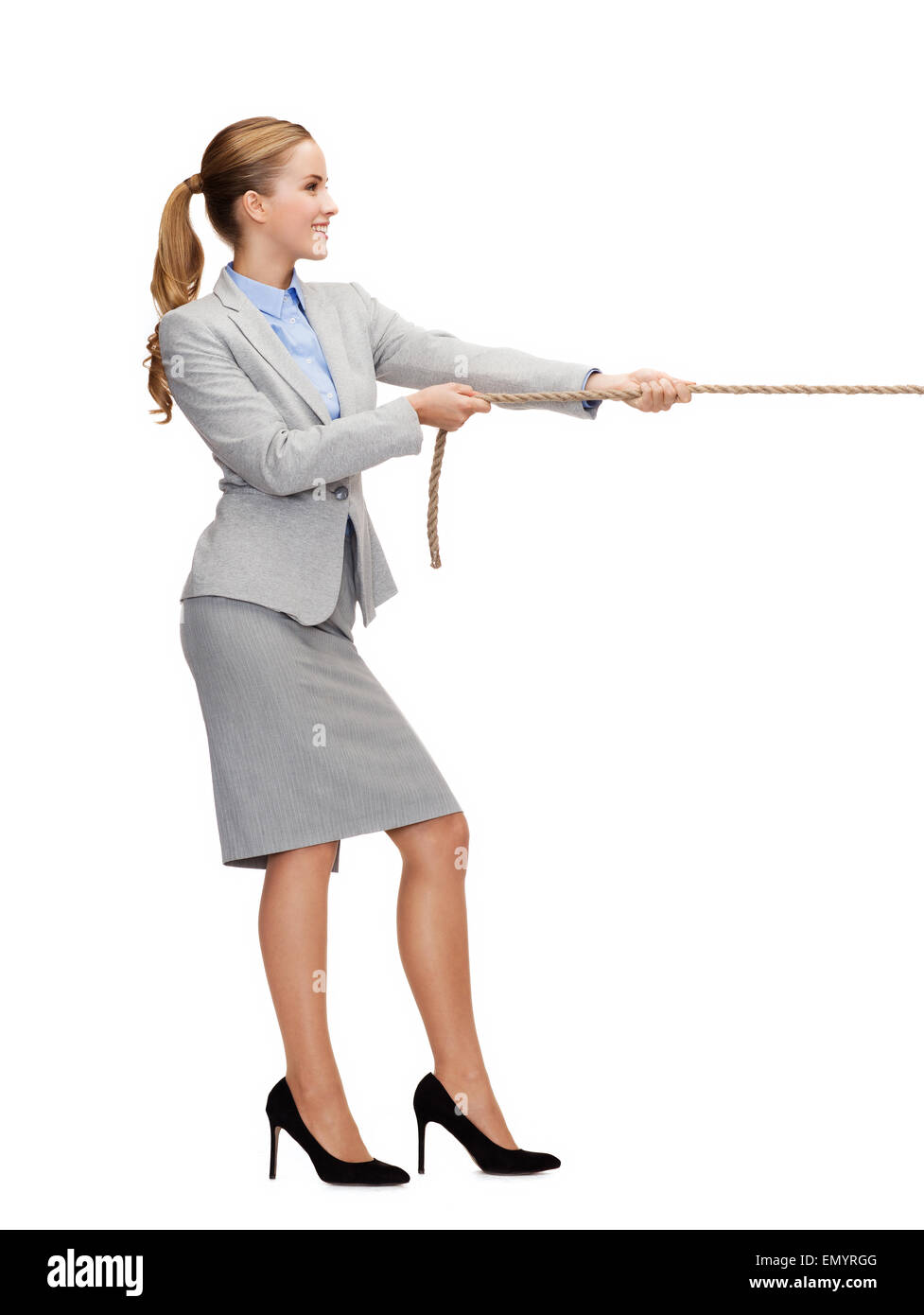 smiling businesswoman pulling rope Stock Photo - Alamy