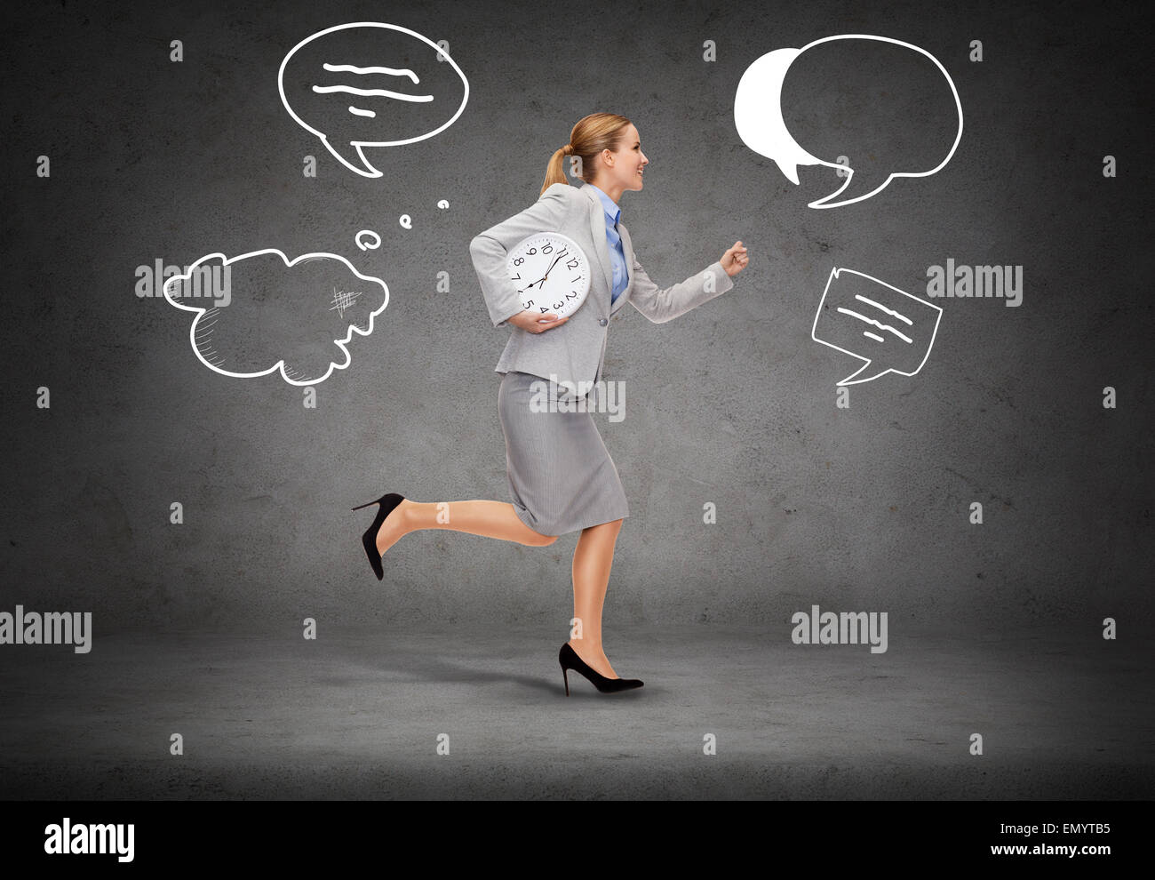 smiling young businesswoman with clock running Stock Photo - Alamy
