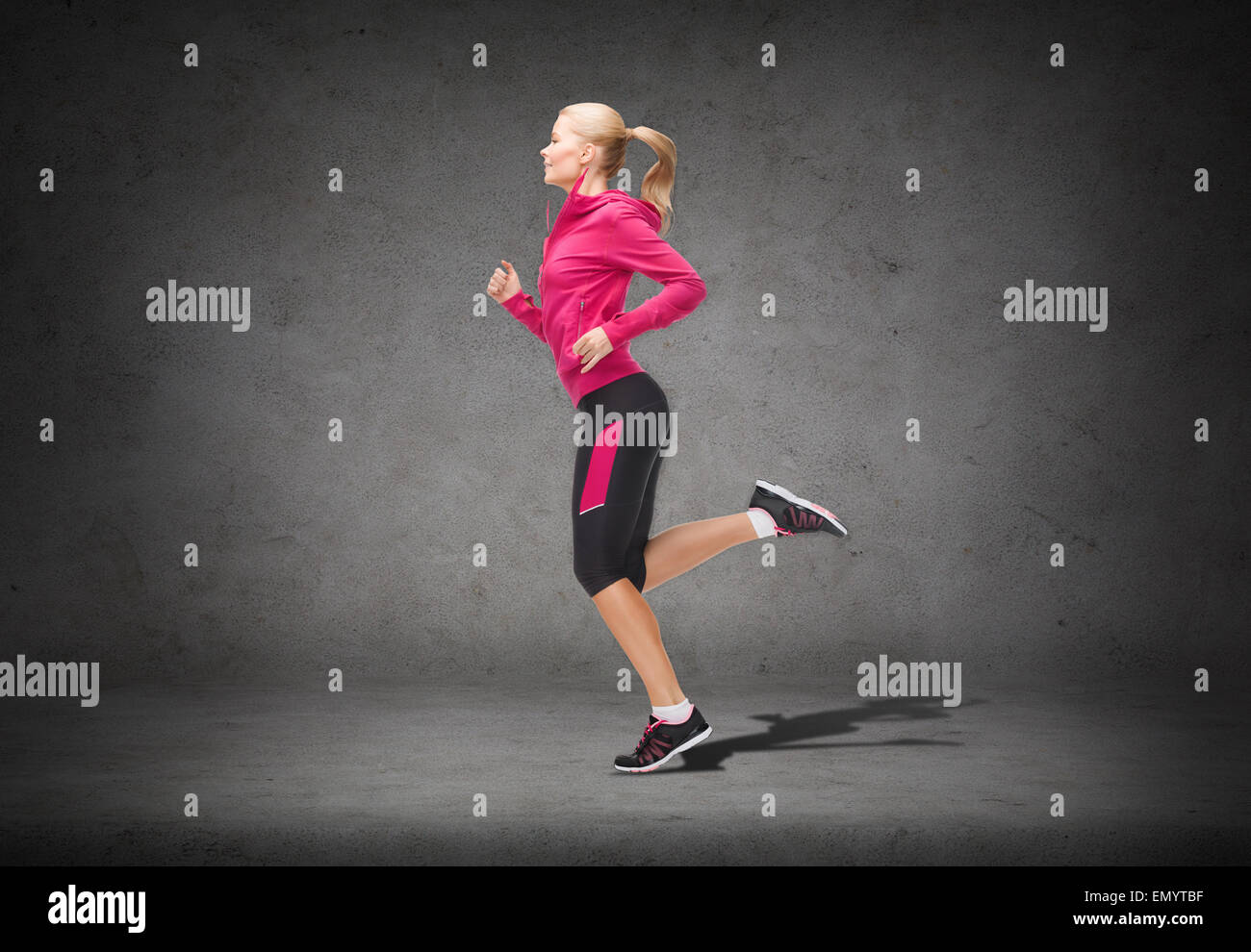 sporty woman running or jumping Stock Photo - Alamy