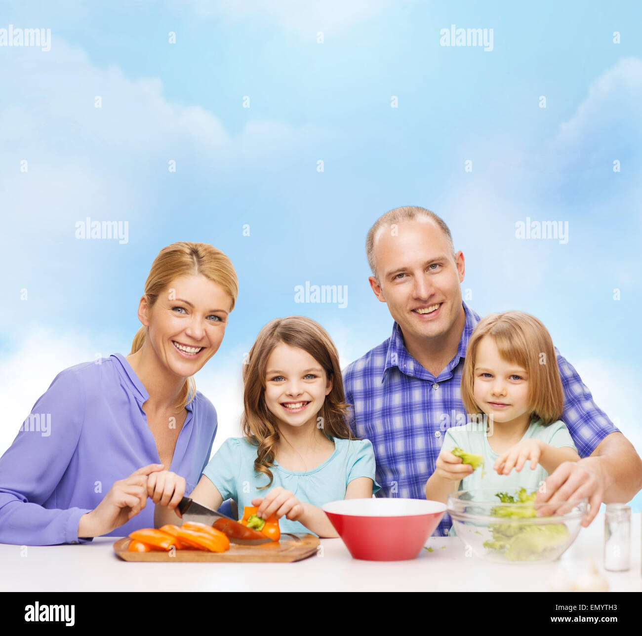 happy family with two kids making dinner at home Stock Photo - Alamy