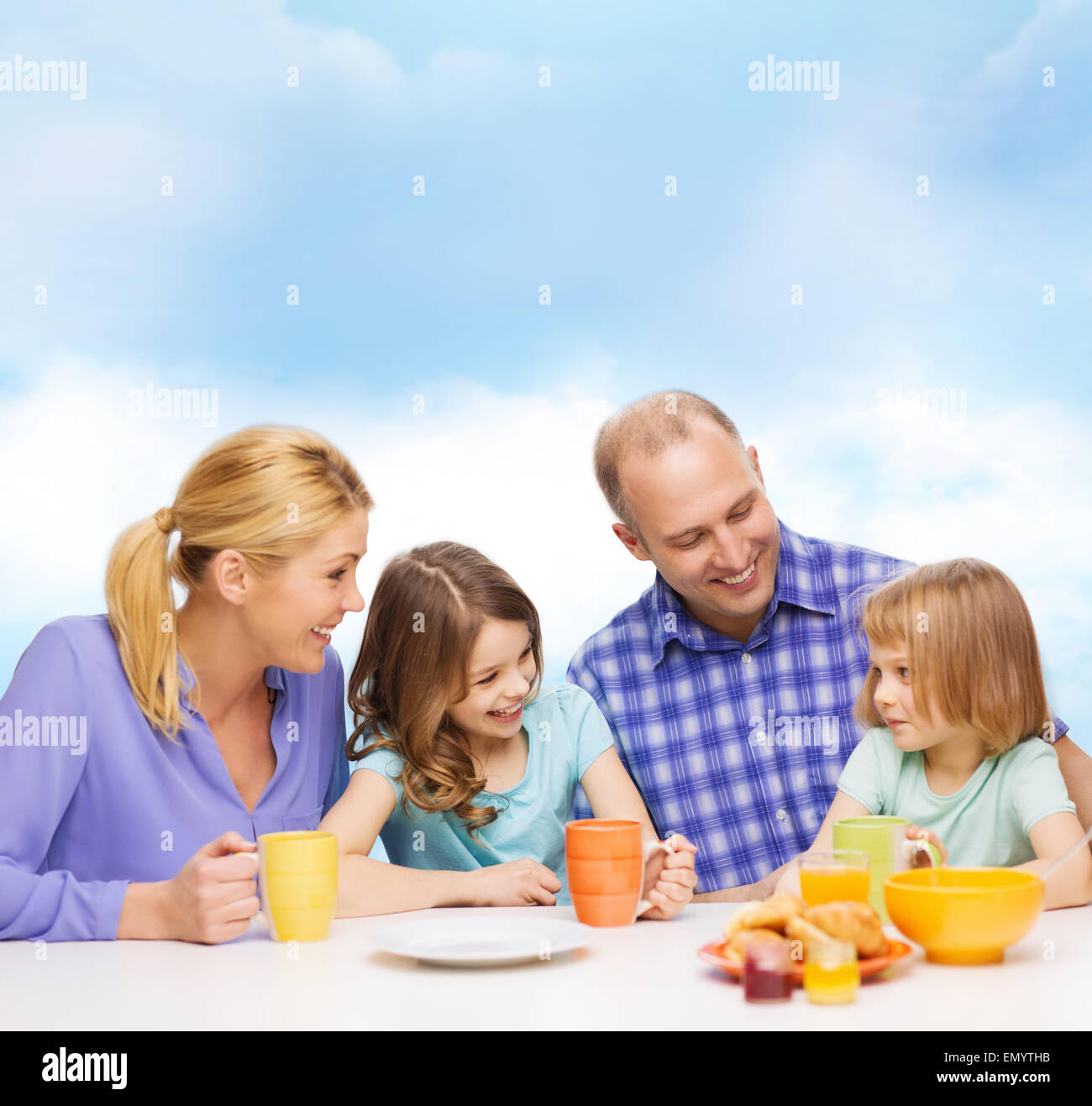happy family with two kids with having breakfast Stock Photo - Alamy
