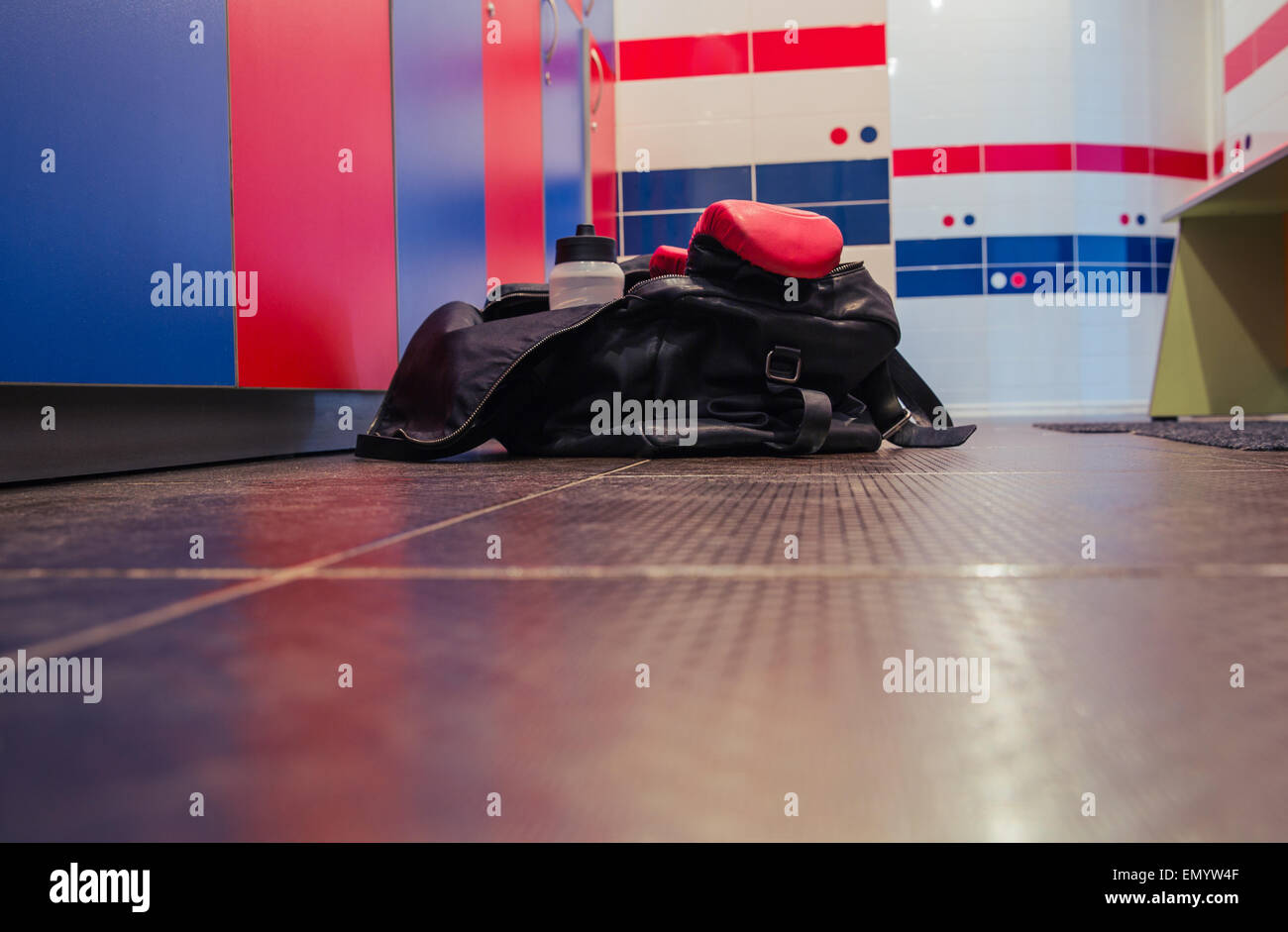 Bag with fitness cloth in locker room on the floor Stock Photo - Alamy