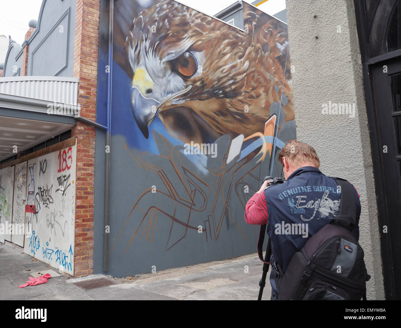 Graffiti, a man is taking photograph of a graffiti Stock Photo - Alamy