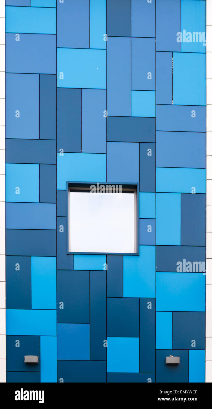 Modern style blue and white building with reflective glass windows ...