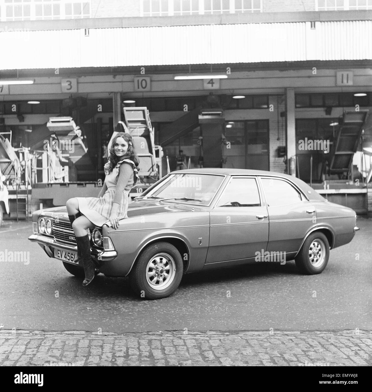 Reveille model Barbara seen here posing with a Ford car which is a top ...