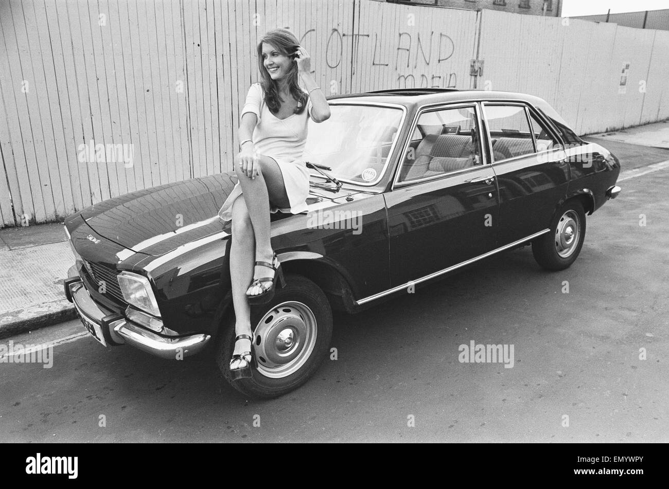 Reveille model Beulah Hughes seen here posing with a Peugeot 504 car ...
