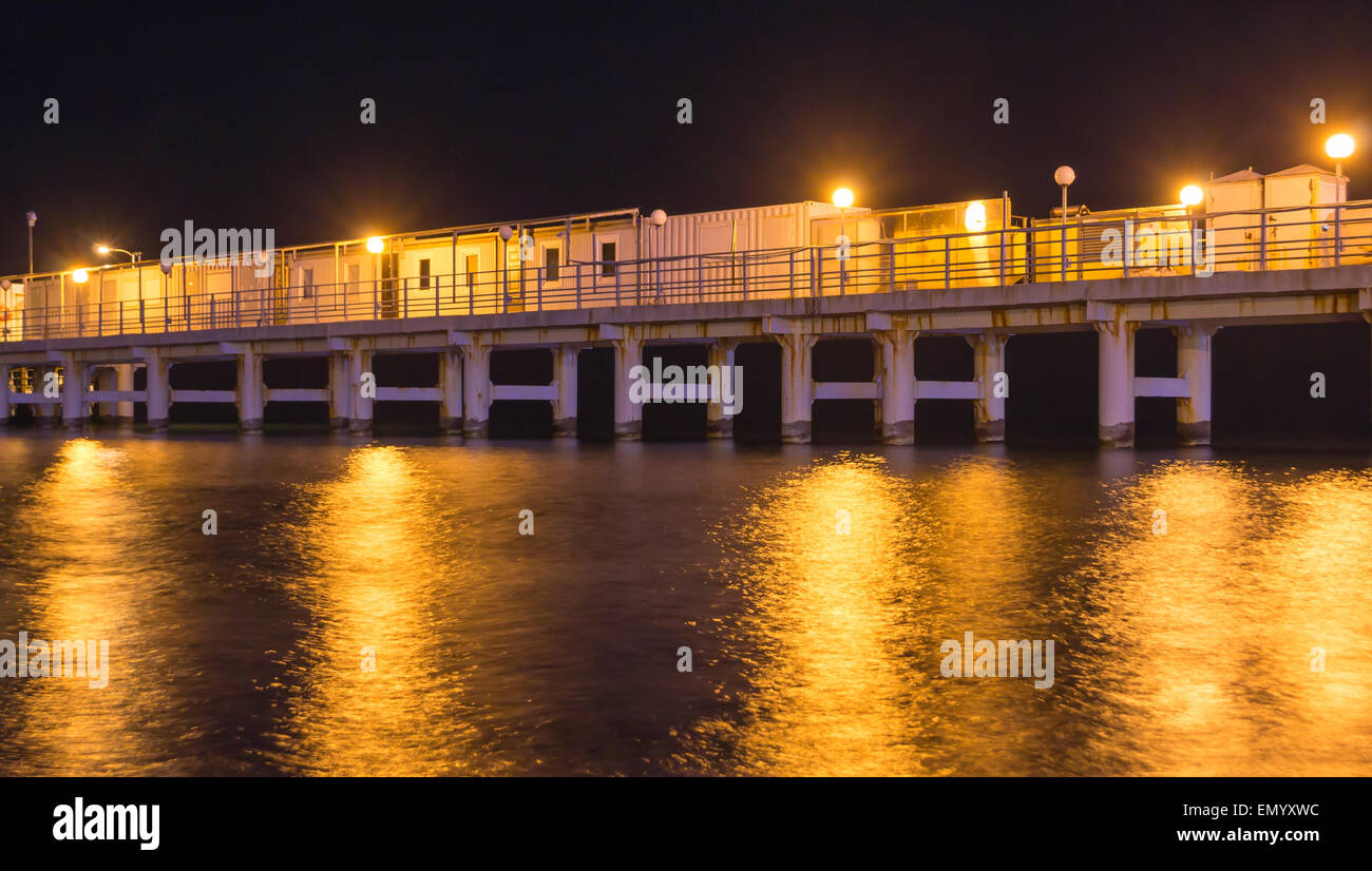 Pier lights provide people with a site to view at nightime Stock Photo ...