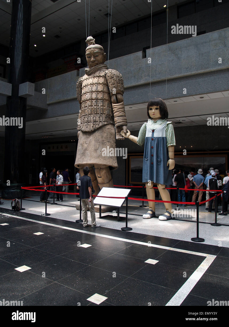 Giant Terracotta Warrior holding hands with smaller young girl puppet ...