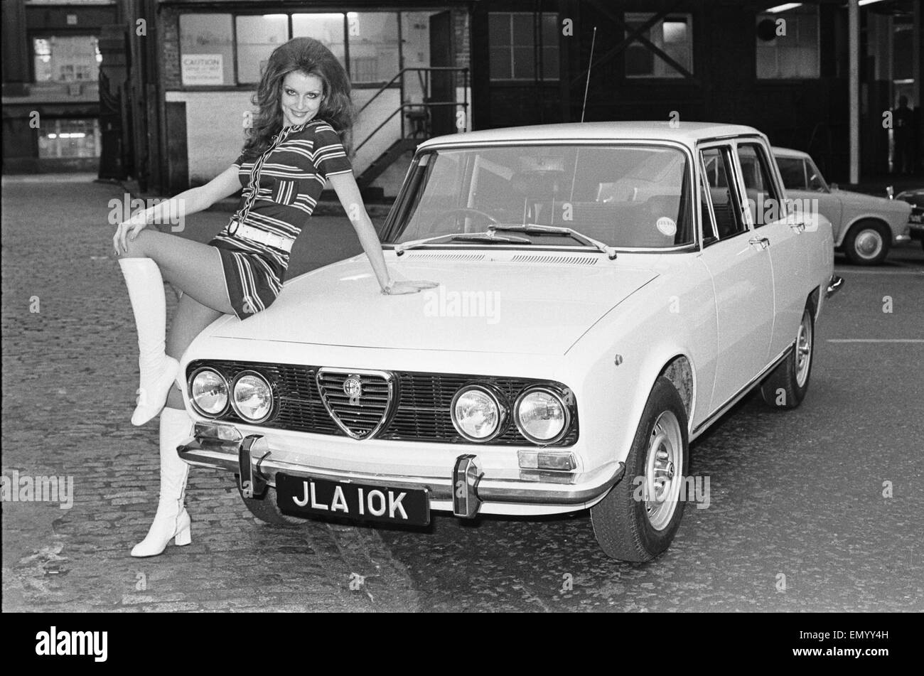 Reveille model seen here posing with a Alfa Romero car which is top ...