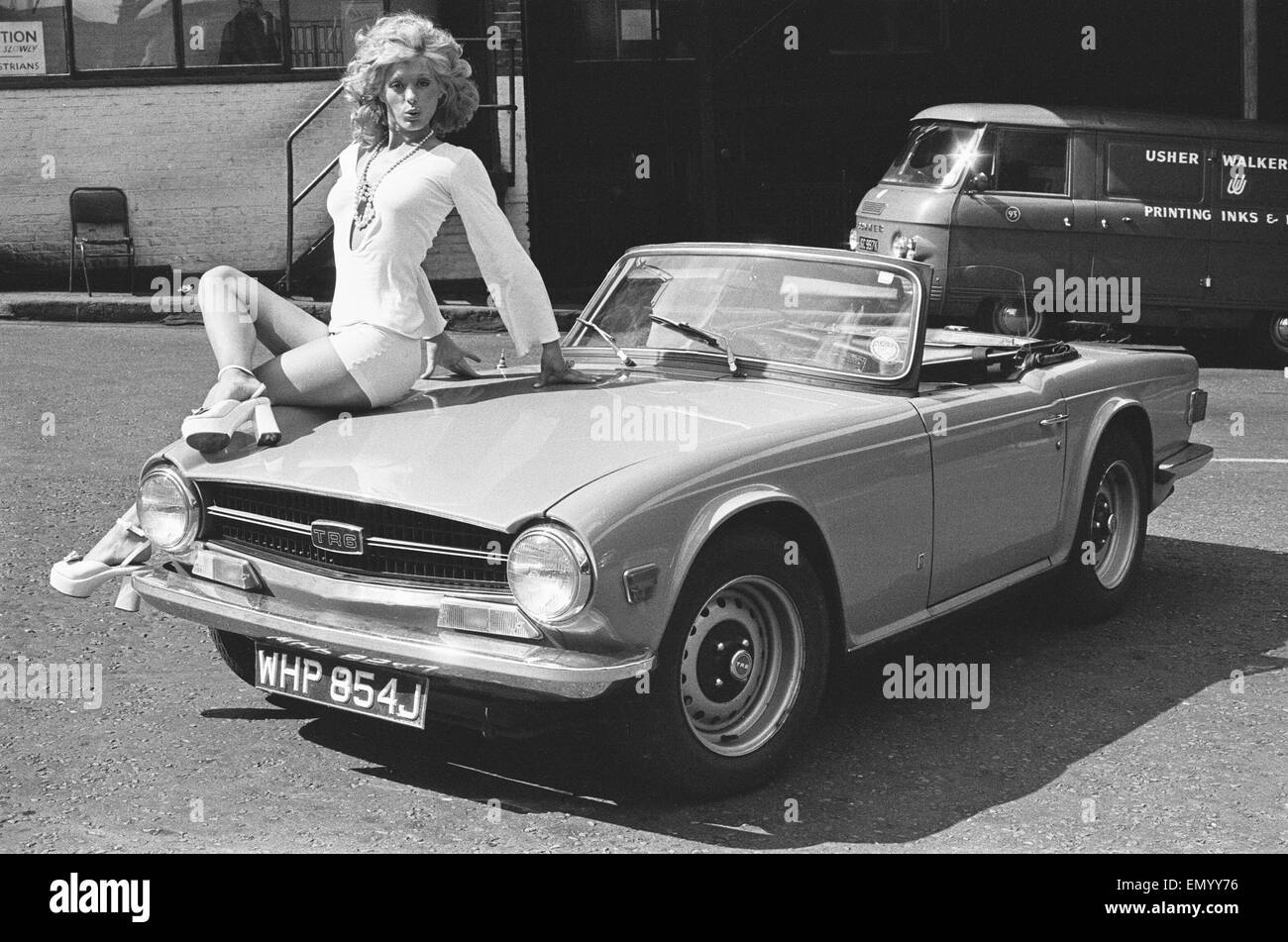 Reveille model Nicky Howarth seen here posing with a TR6 car which is ...
